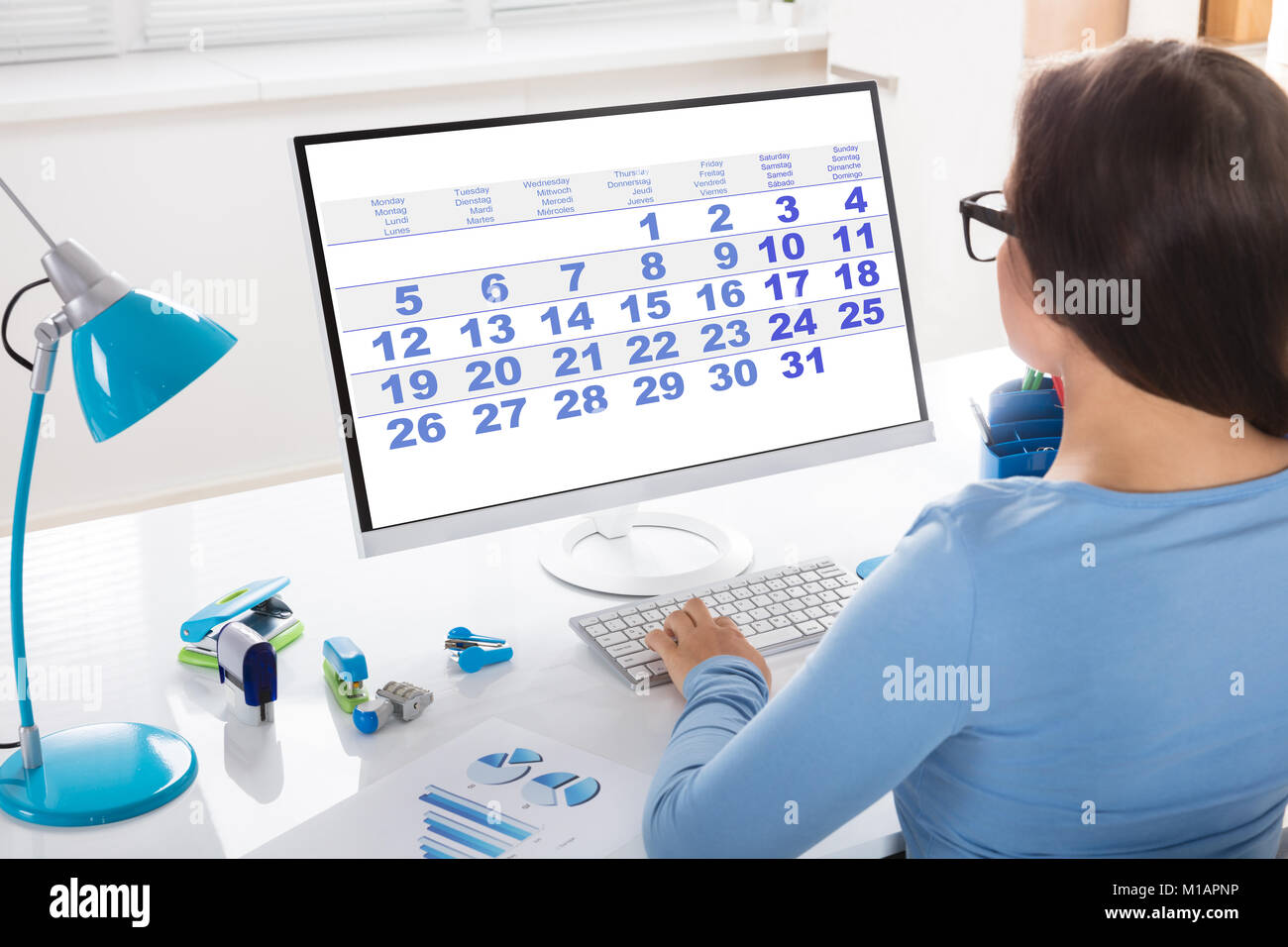 Close-up Of A Businesswoman Looking At Calendar On Computer In Office ...