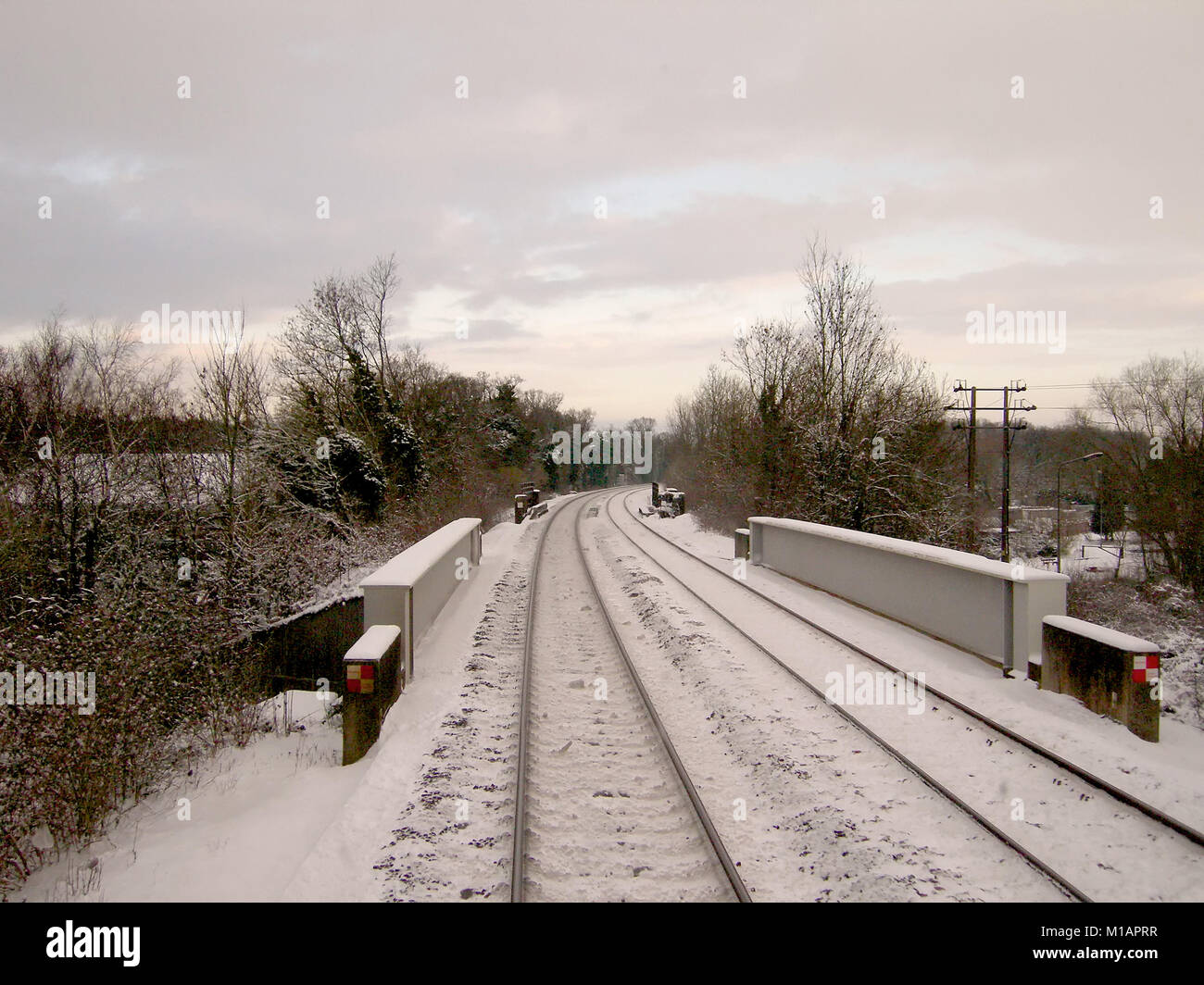 Railway lines in the winter snow Stock Photo - Alamy