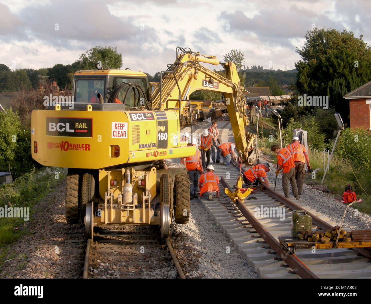 Track renewals with plant equipment and man power Stock Photo - Alamy