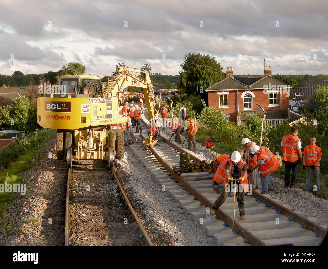 Track renewals with plant equipment and man power Stock Photo - Alamy