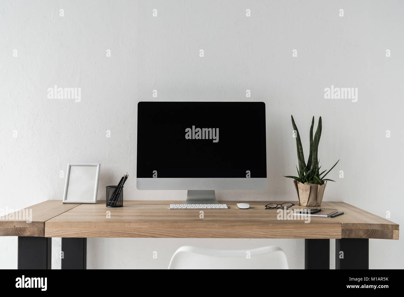 workplace with computer in modern office Stock Photo - Alamy