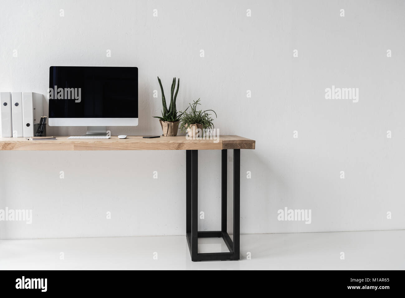 workplace with computer in modern office Stock Photo - Alamy