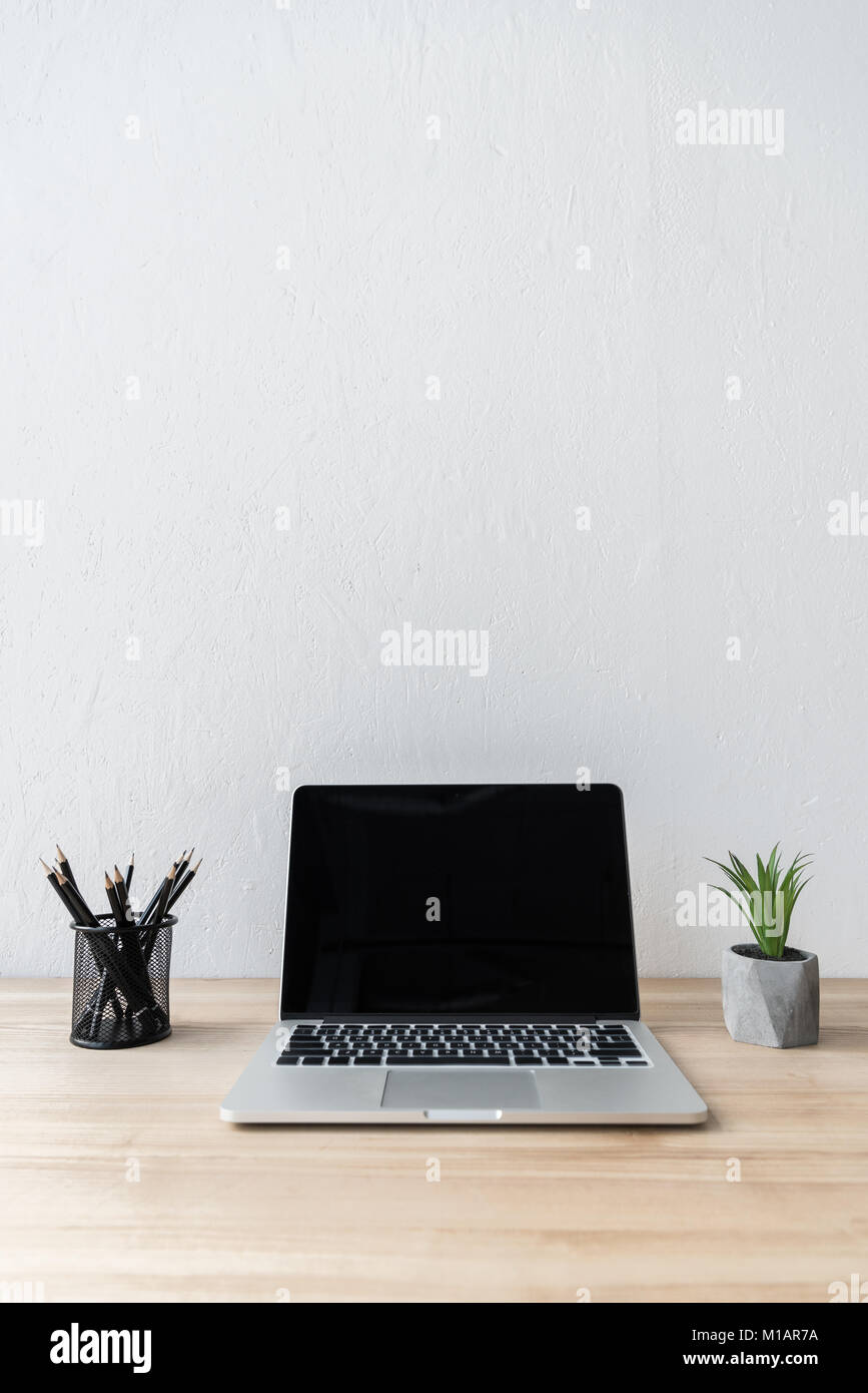 workplace with laptop computer Stock Photo - Alamy