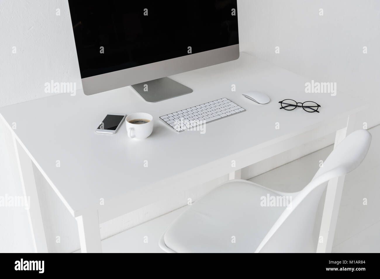 workplace with computer in modern office Stock Photo - Alamy