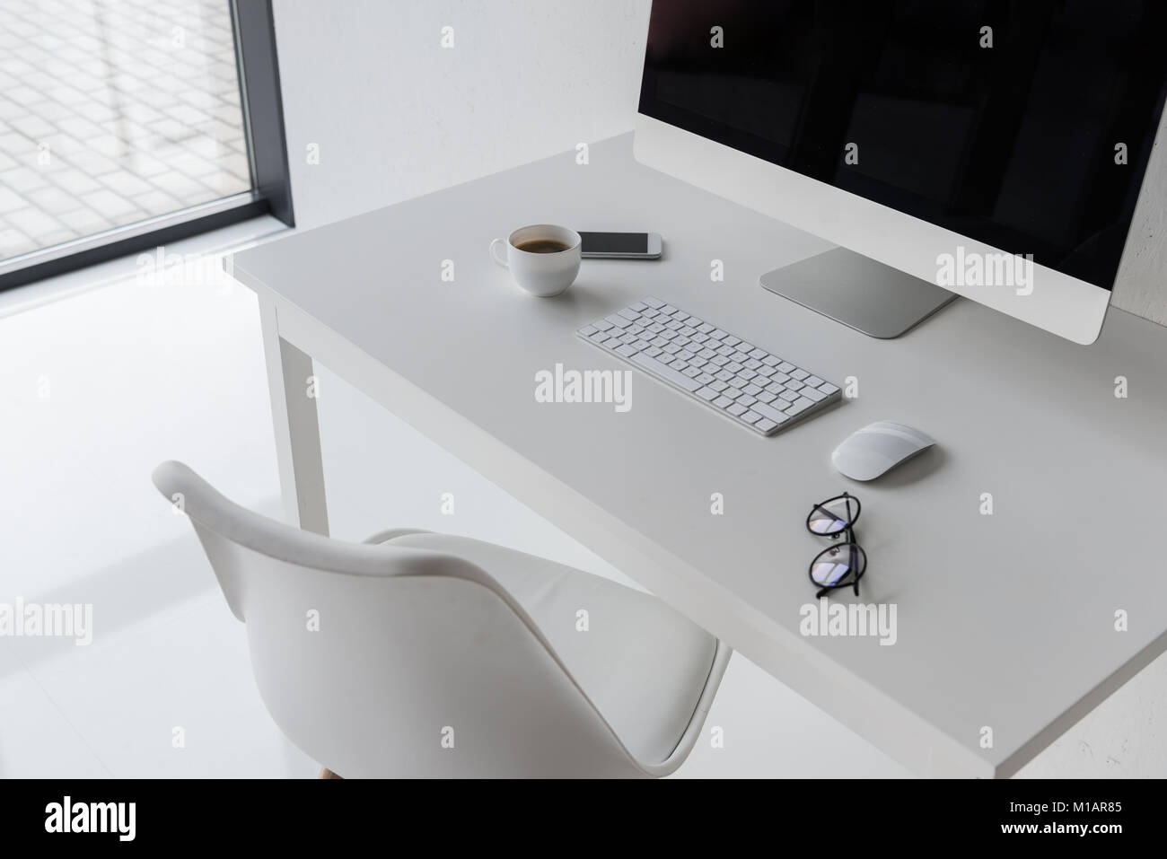 workplace with computer in modern office Stock Photo - Alamy