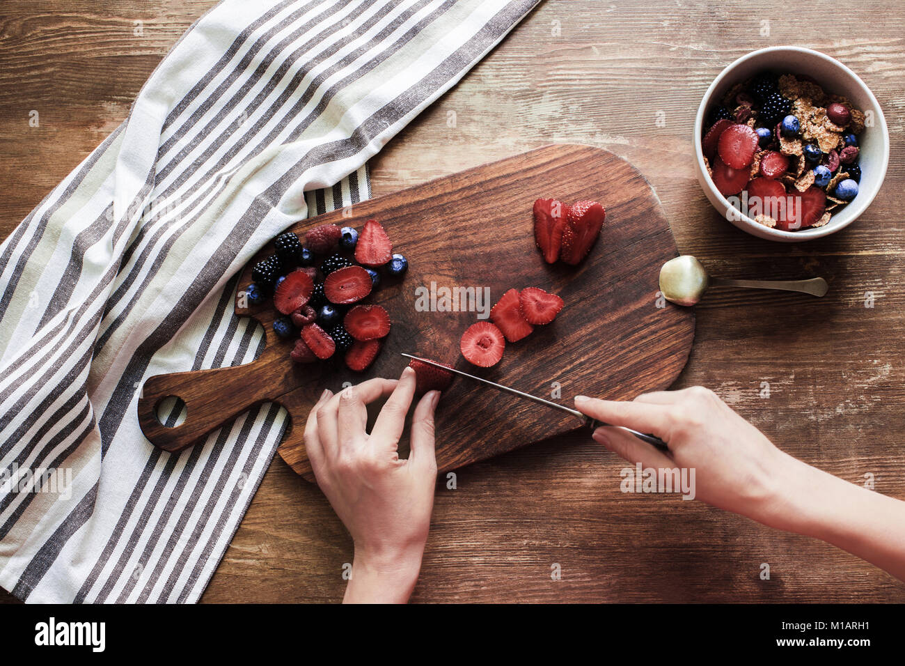 woman cutting berries Stock Photo - Alamy