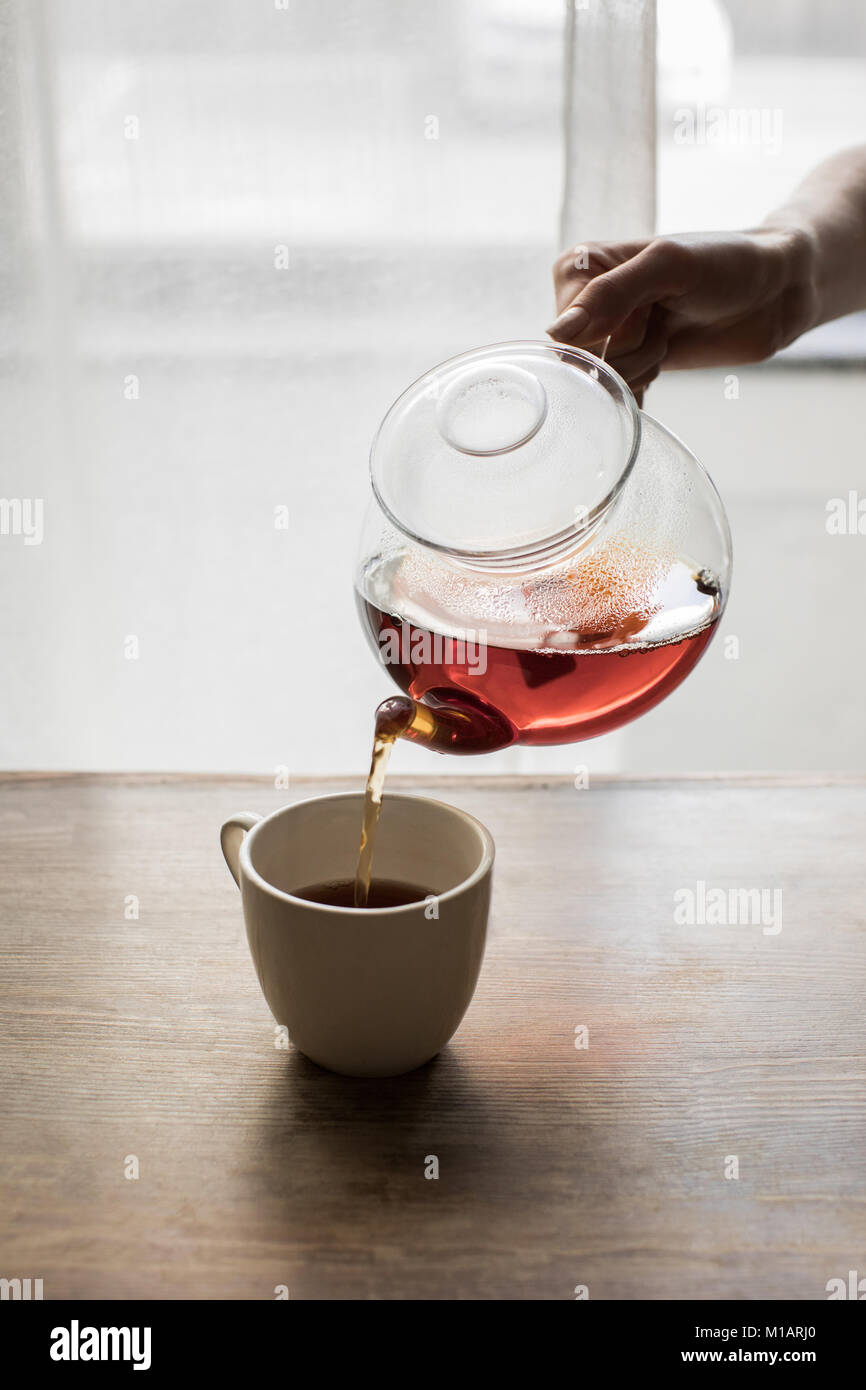 person pouring tea Stock Photo - Alamy