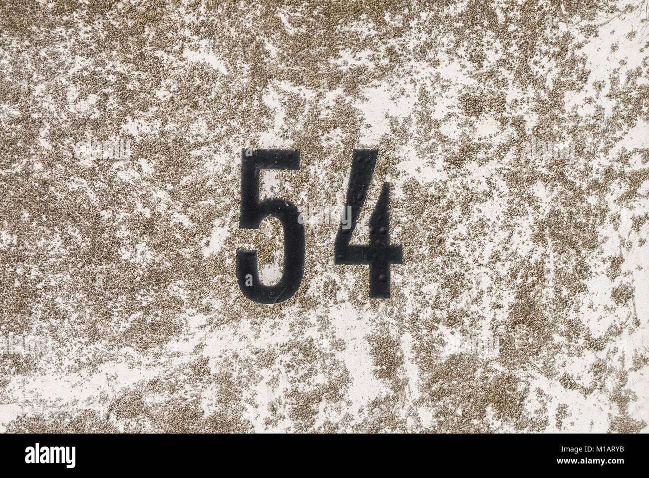 The Number 54, fifty four, on a surface with lichen Stock Photo - Alamy