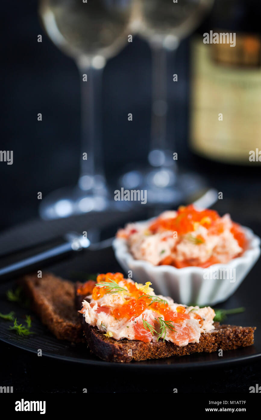 Salmon pate (rillettes) with red caviar served with sliced bread Stock ...