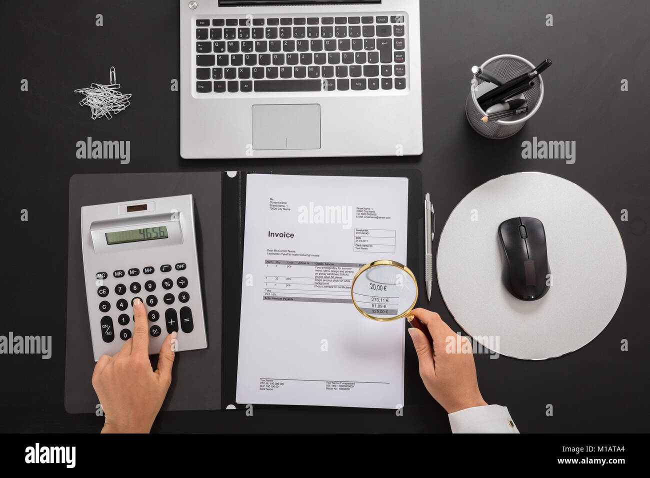 Close-up Of A Businesswoman Looking Invoice Through Magnifying Glass ...