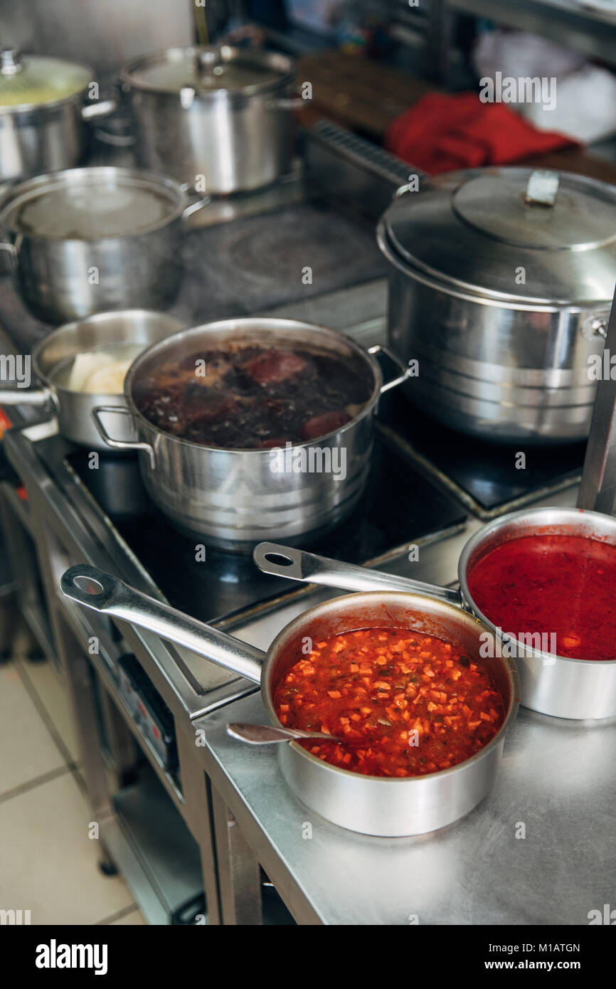 various food in sauce pans at restaurant kitchen Stock Photo - Alamy
