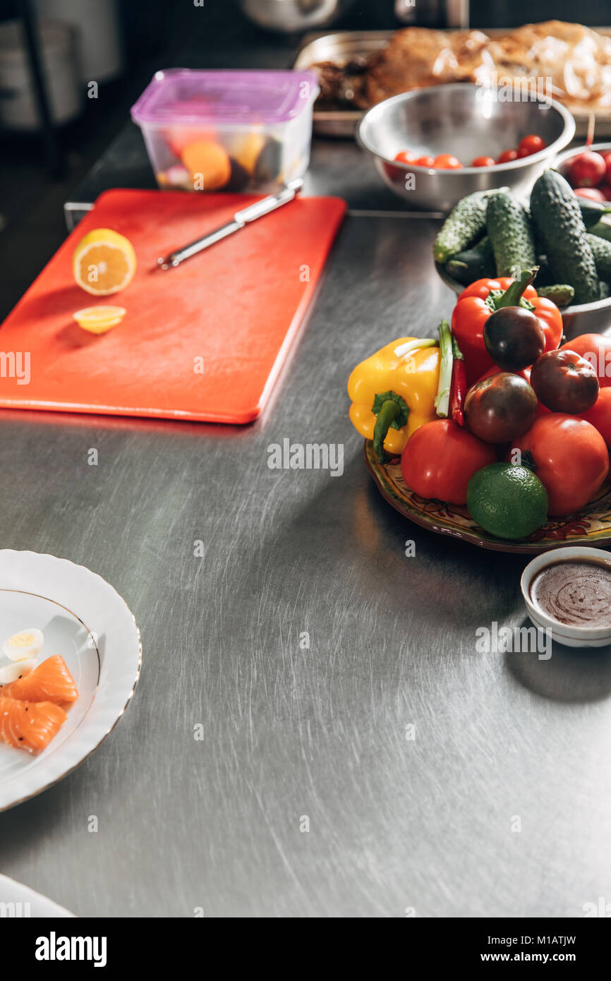 various cooking ingredients on table at restaurant kitchen Stock Photo ...