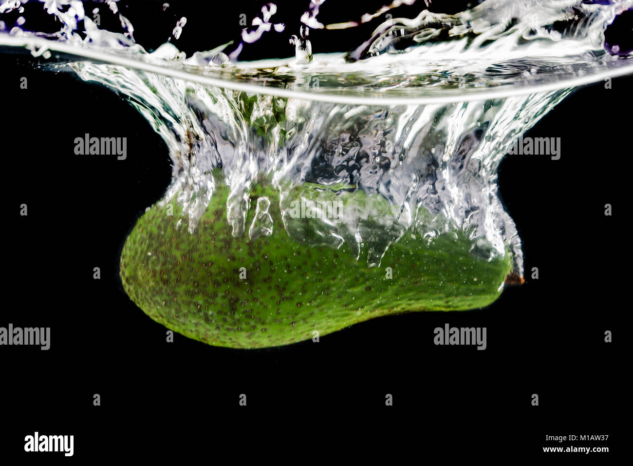 Avocado splash water Stock Photo - Alamy
