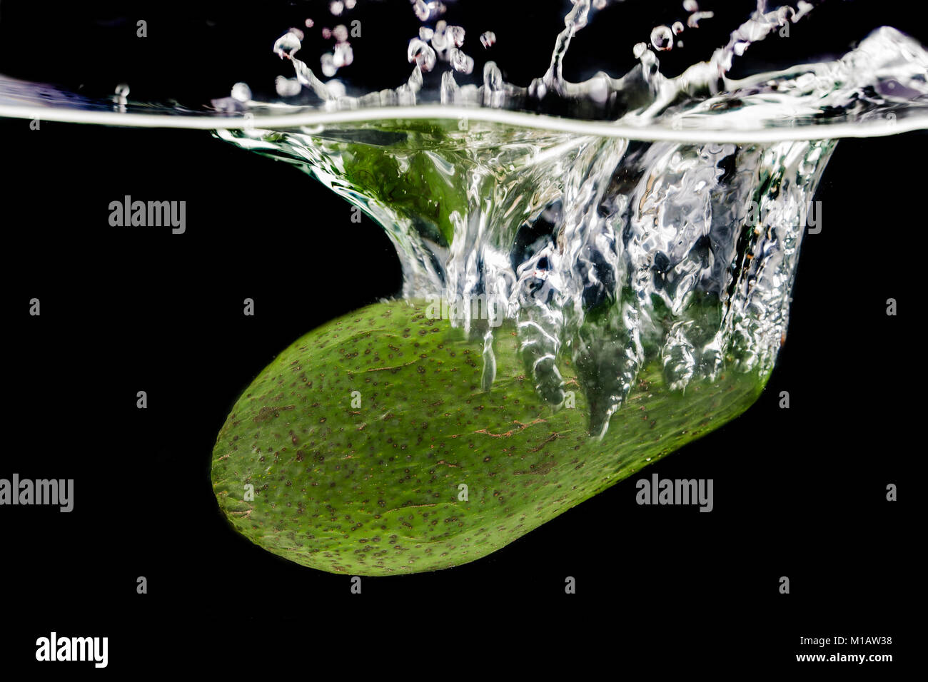 Avocado splash water Stock Photo - Alamy