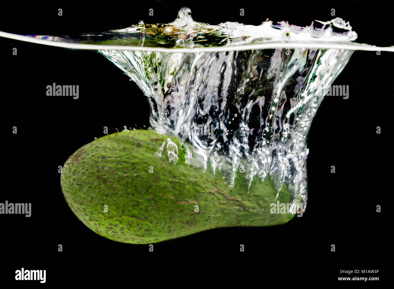 Avocado splash water Stock Photo - Alamy