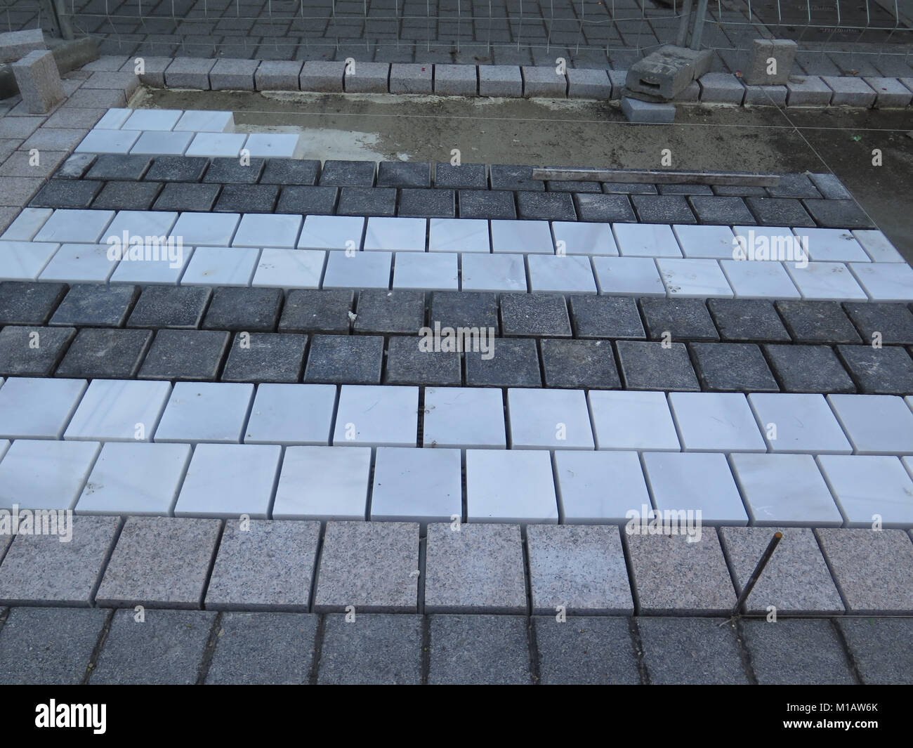 Square paving stones in pedestrian crossing awaiting grouting in ...