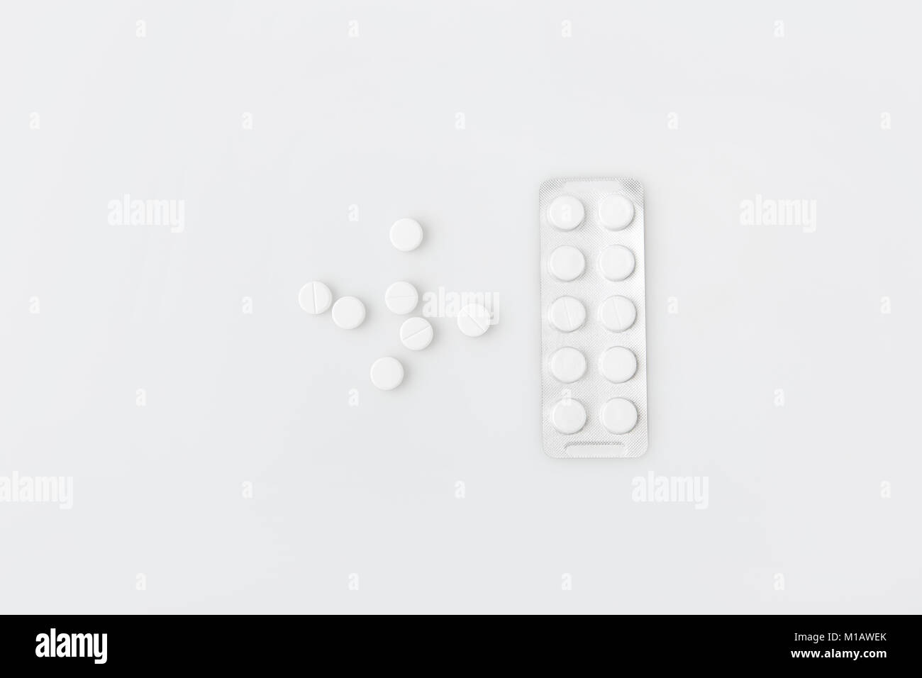 scattered pills and tablets in package isolated on white background ...