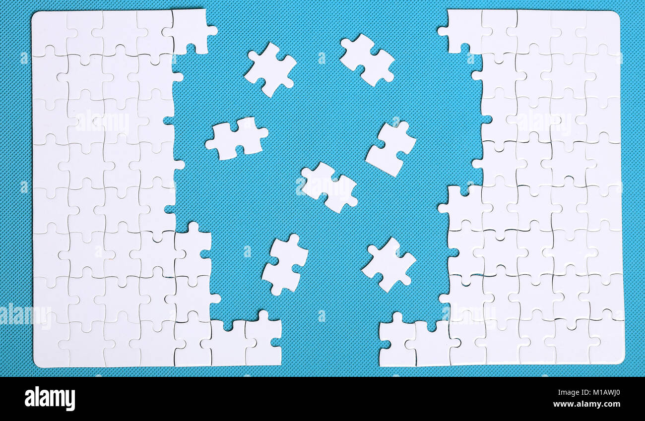 White details of puzzle on background. A puzzle is a puzzle from small ...
