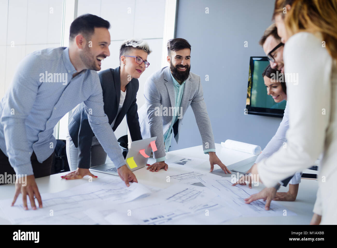 Group of architects working on project Stock Photo - Alamy