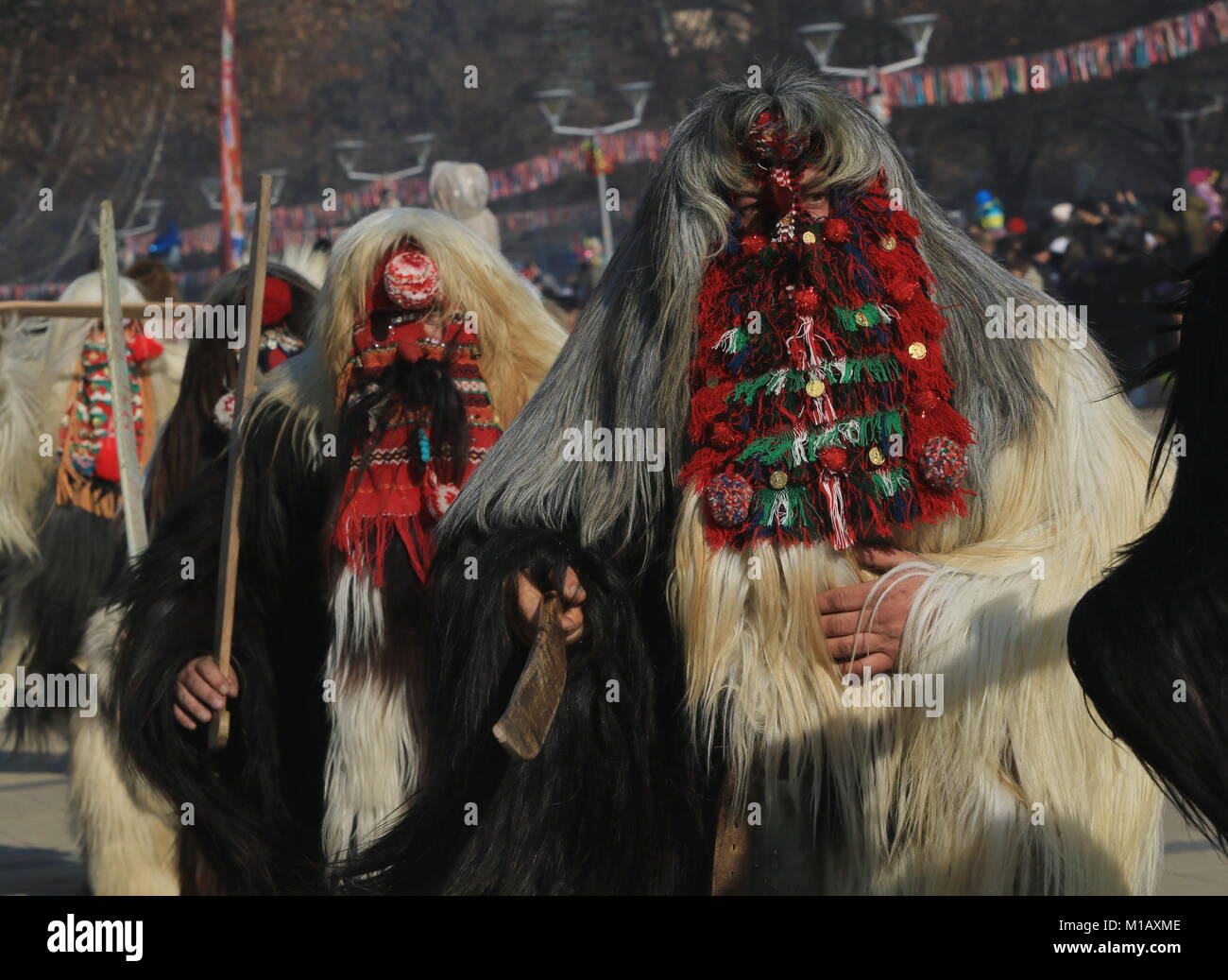 People with mask called Kukeri dance and perform to scare the evil ...