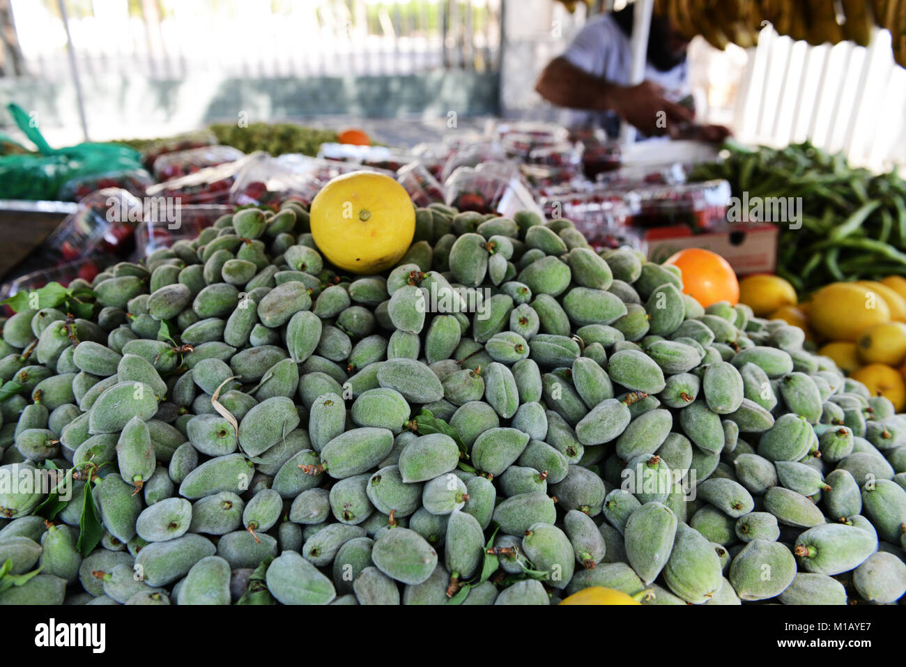 Fresh green almond stall in Jordan Stock Photo - Alamy