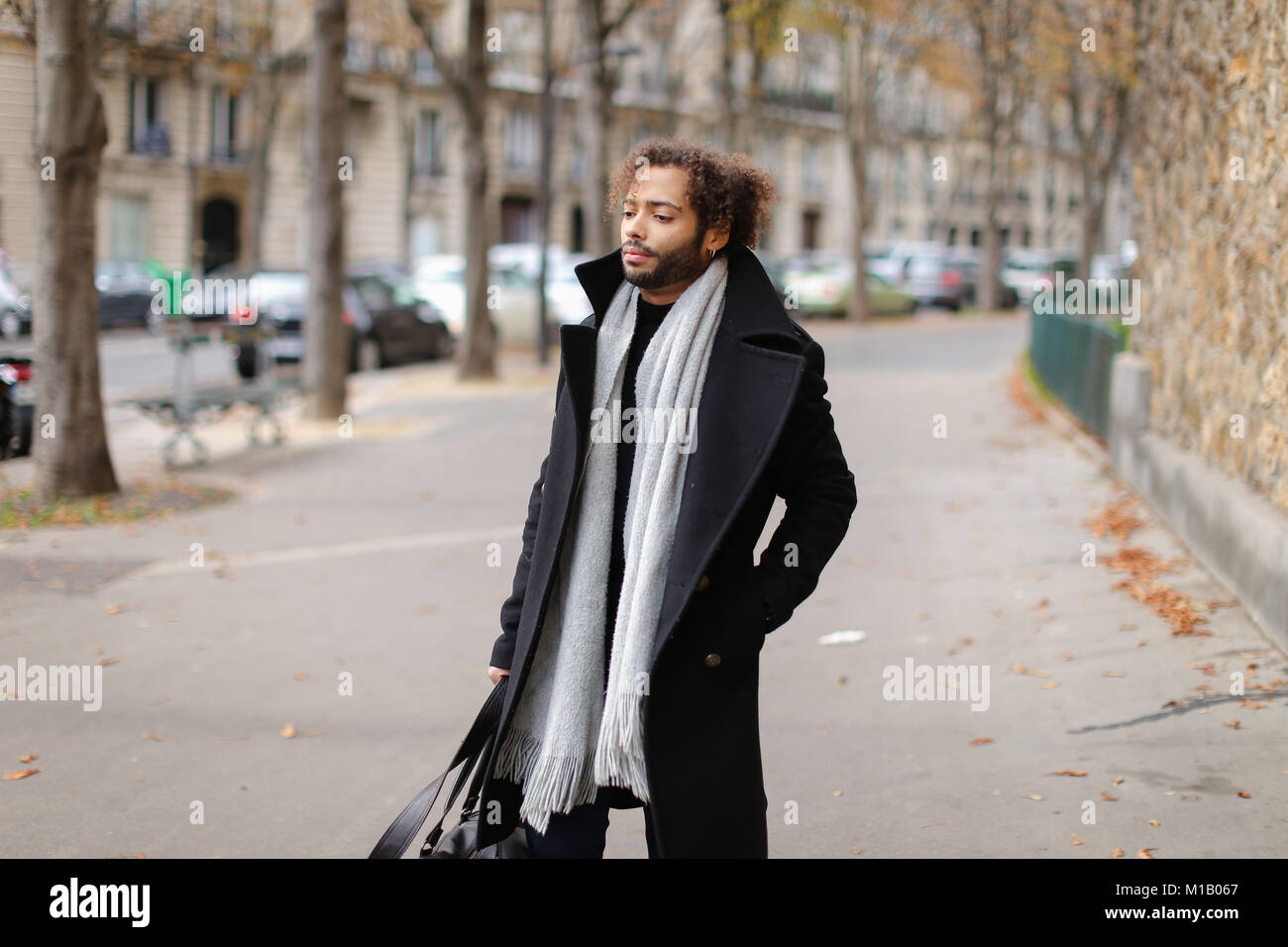 Happy half African tourist visiting Europe and walking with bag Stock ...