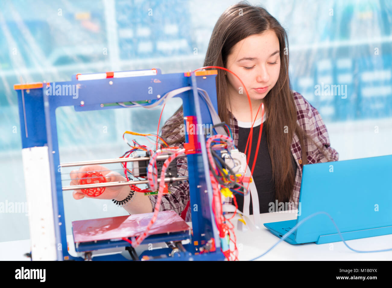 Girl schoolgirl with a 3D printer Stock Photo - Alamy