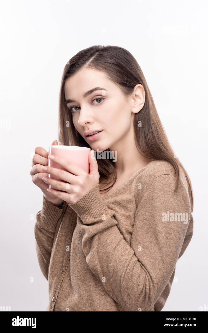 Tender young woman posing with coffee mug Stock Photo - Alamy