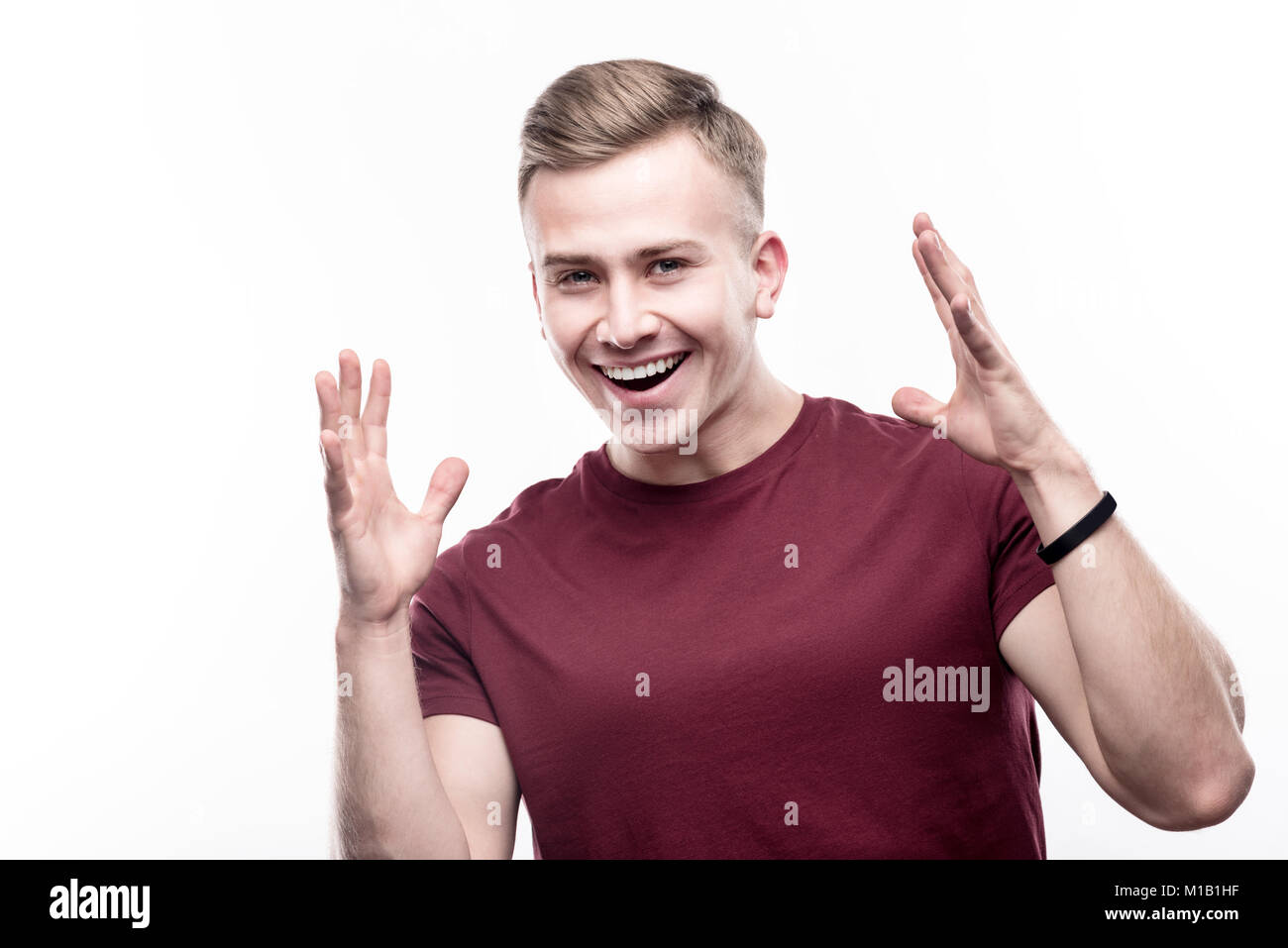 Happy man making dancing moves and posing Stock Photo - Alamy