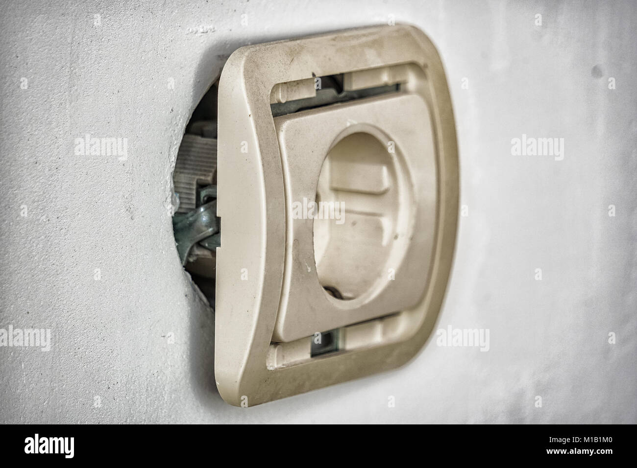 Electrical socket outlet falling out of wall Stock Photo - Alamy