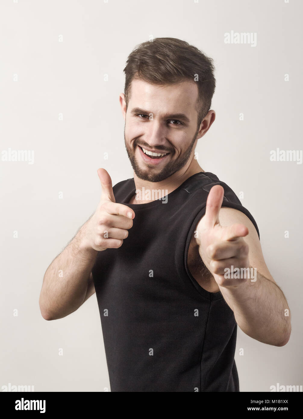 portrait of confident modern men.isolated on gray background Stock ...