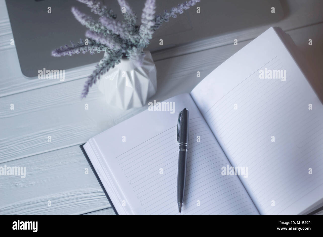 pen and a notebook at the workplace Stock Photo - Alamy
