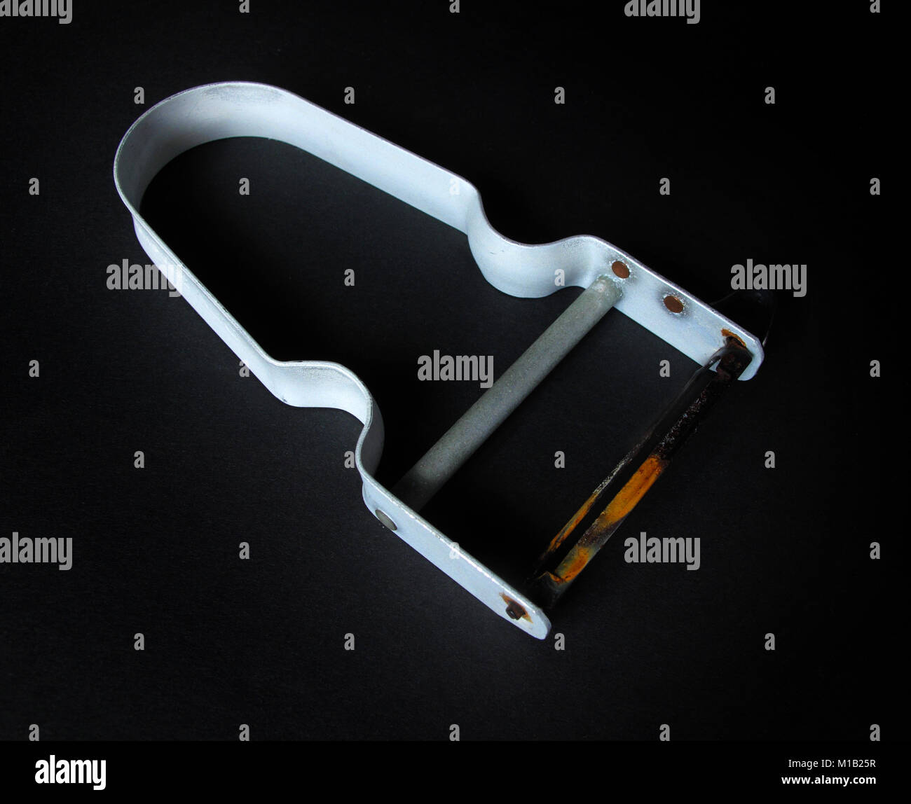 Old vegetable peeler Stock Photo - Alamy