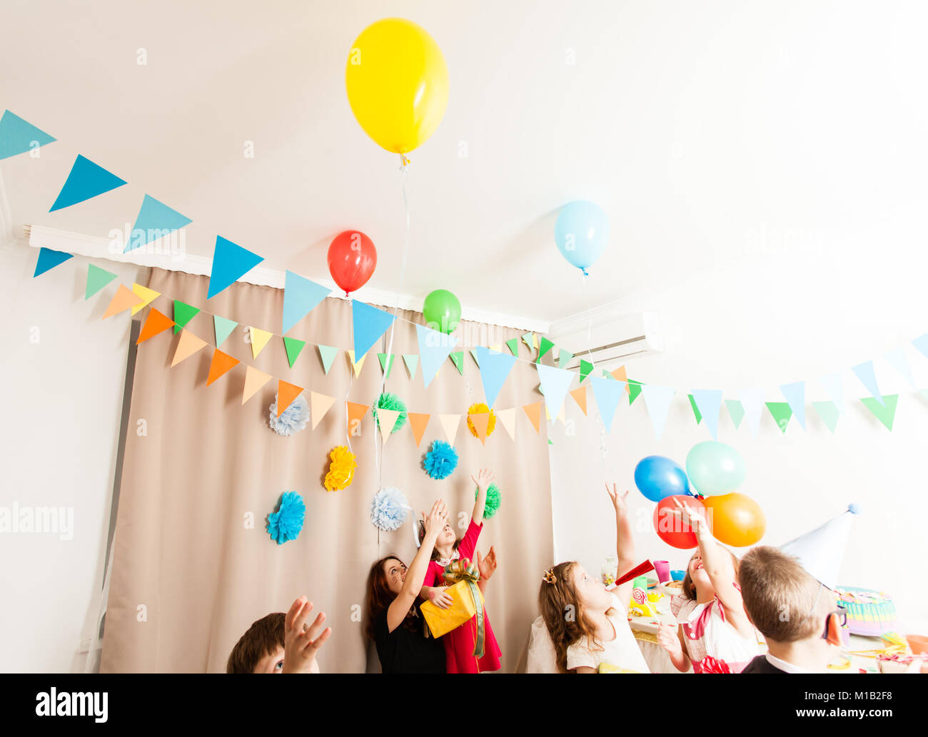 Celebrating birthday party Stock Photo - Alamy