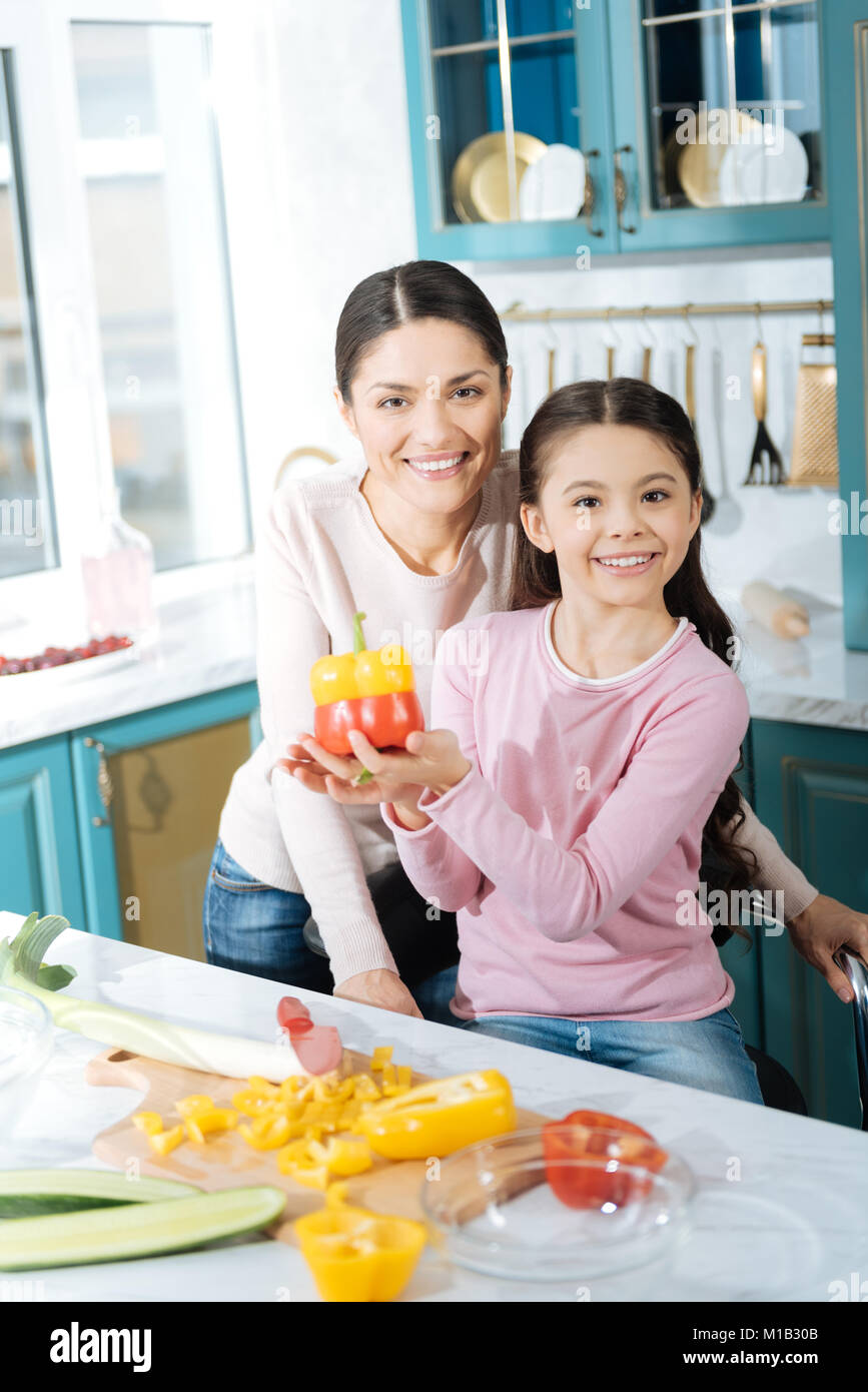 Delighted mother and daughter cooking together Stock Photo - Alamy