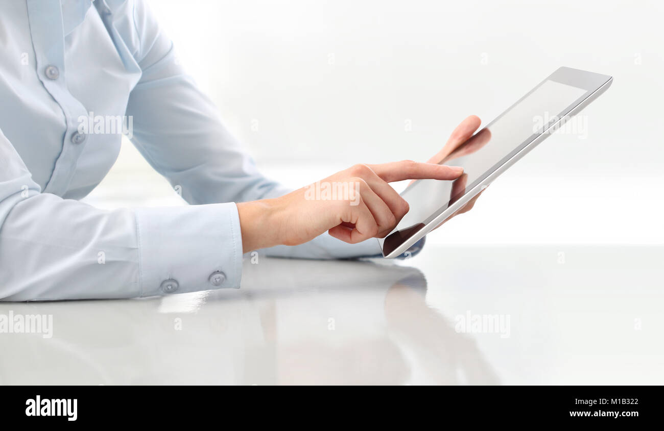 hand touching screen digital tablet close up on desk Stock Photo - Alamy