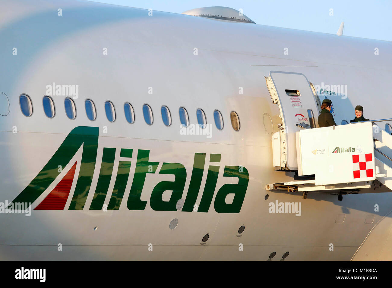 Alitalia plane departing, hostesses welcome passengers, Leonardo da ...