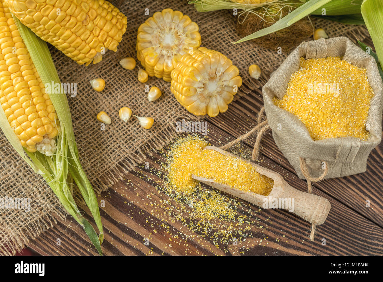 Fresh corn on cobs on rustic wooden table, top view. Dark wooden ...