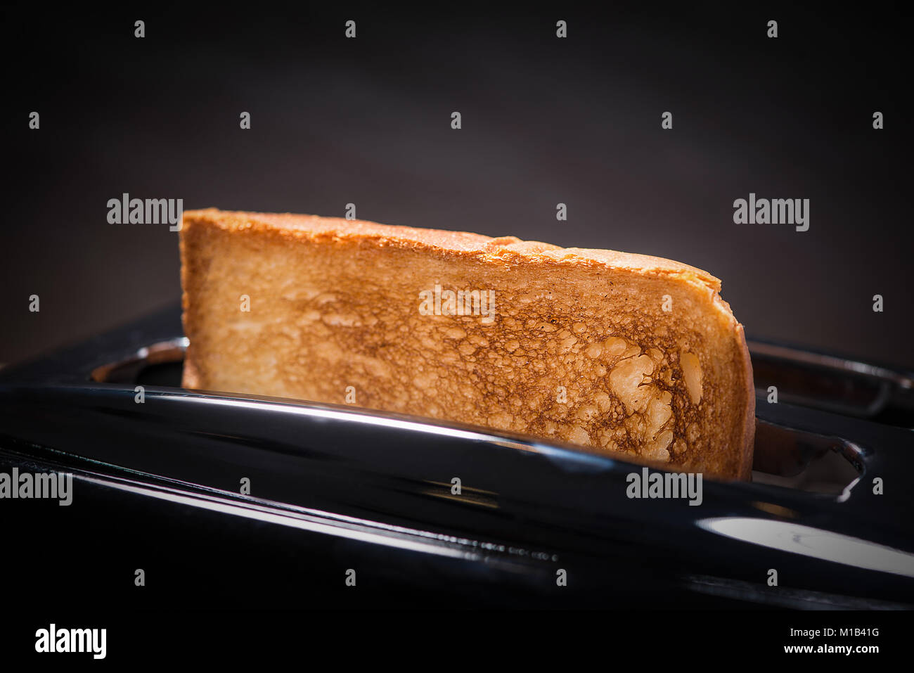 Close-up view of pastries in a toasting device. Fried toast slices ...