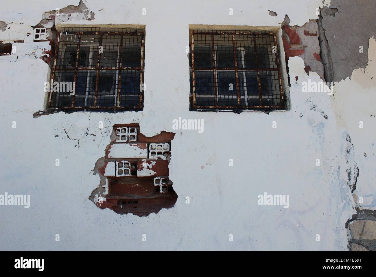 Old and damaged wall texture with windows Stock Photo - Alamy