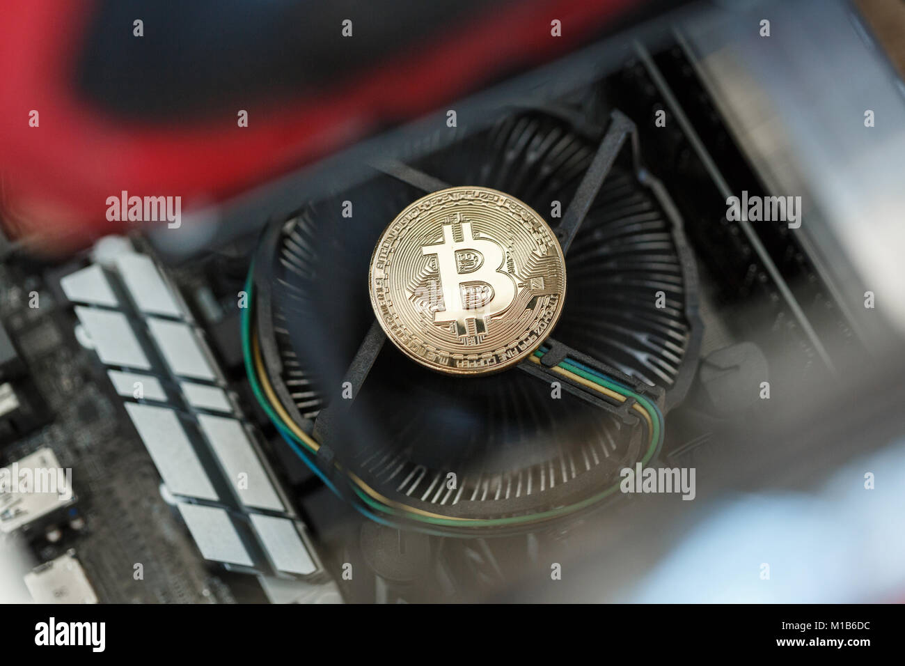 Golden metal coin as symbolic version of Bitcoin on a background of ...
