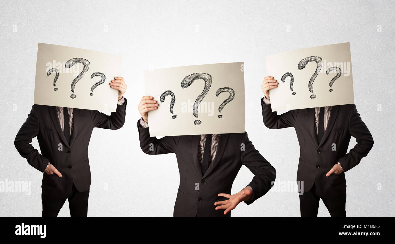 Handsome people in formal gesturing with drawn question marks on ...