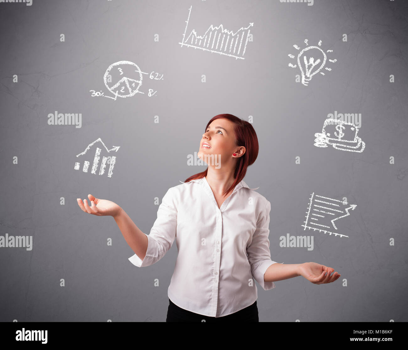 beautiful young woman standin and juggling with statistics and graphs ...