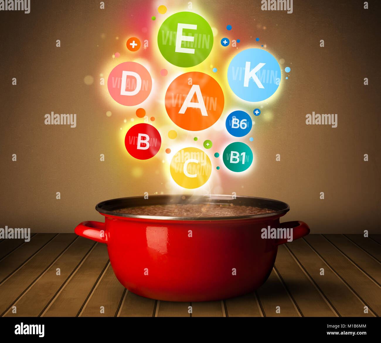 Colorful vitamins coming out from cooking pot, healthy food concept ...