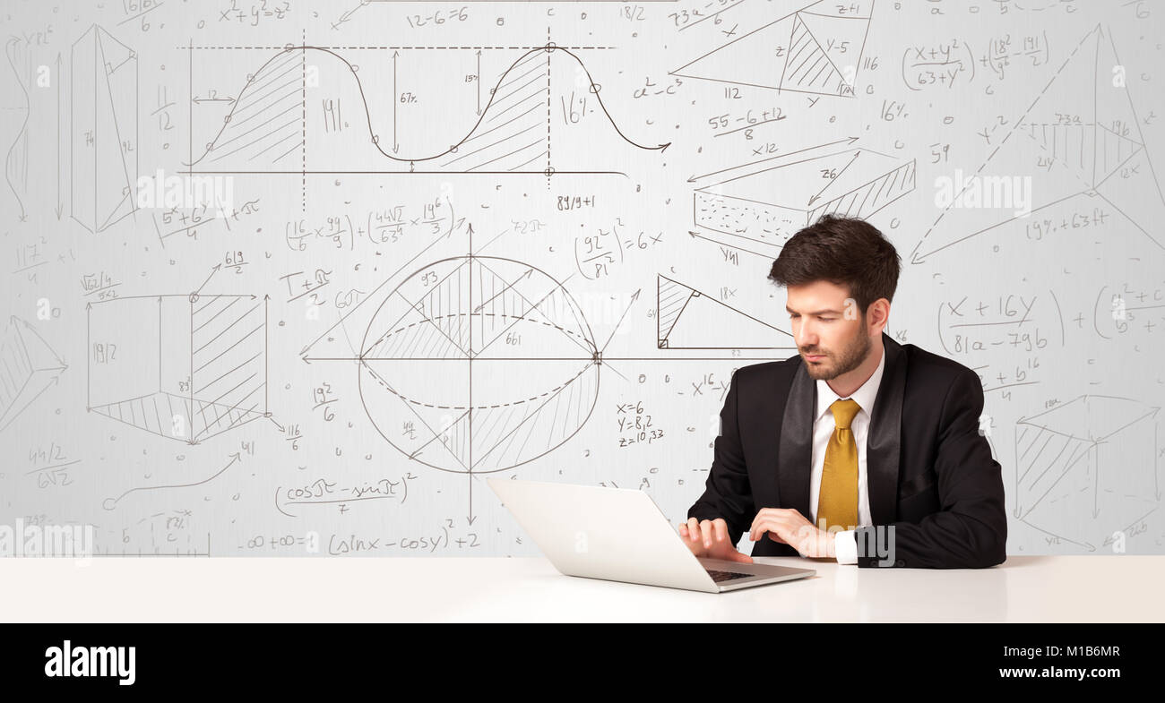 Business man sitting at white table with hand drawn calculations ...