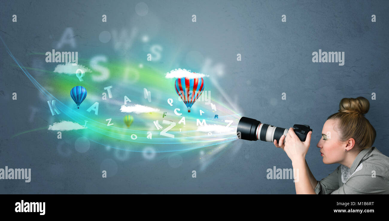 Cute photographer girl with camera and abstract imaginary Stock Photo ...