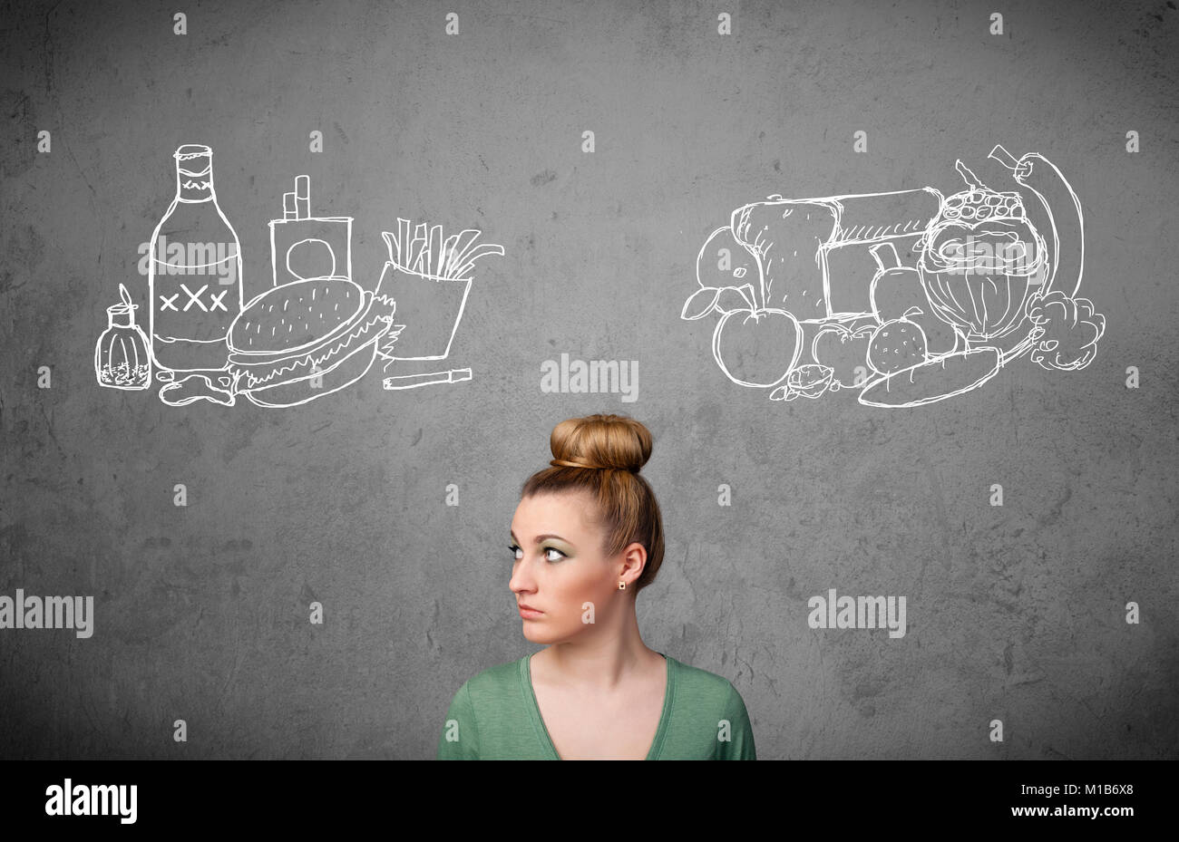 Woman choosing between foods hi-res stock photography and images - Alamy