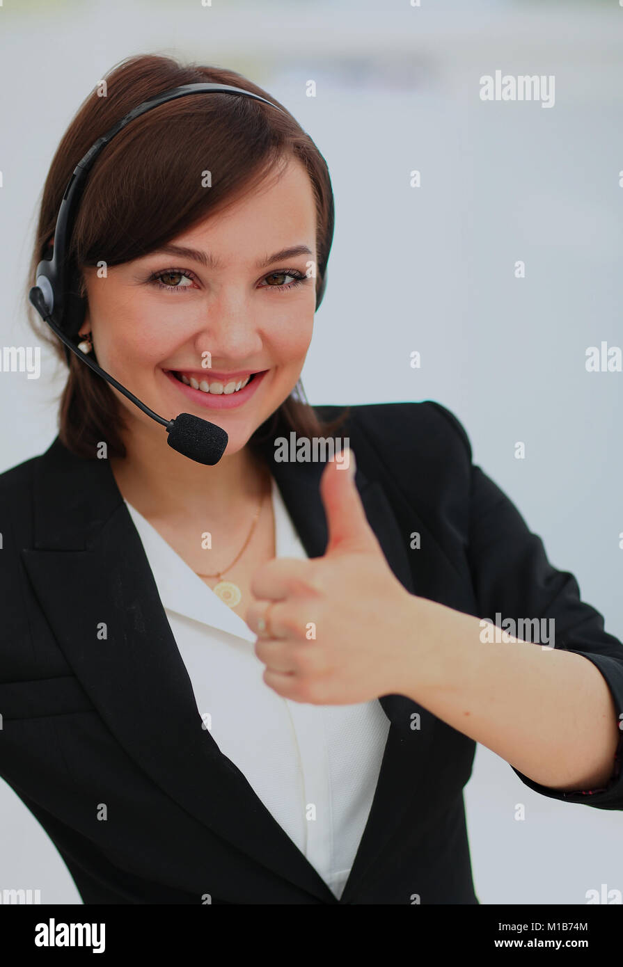 Portrait of happy smiling cheerful support phone operator in headset at ...
