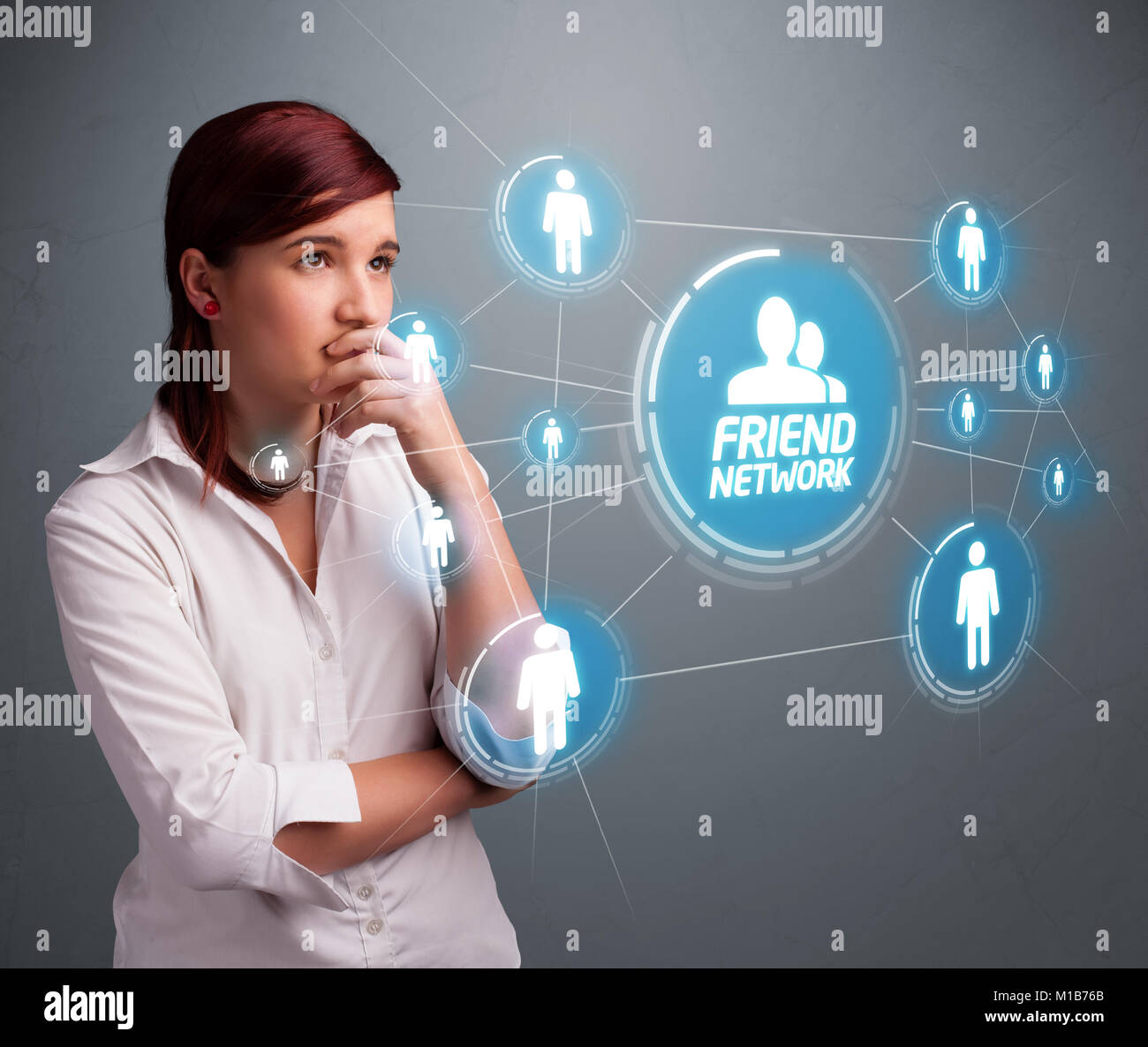 Attractive young girl looking at modern social network Stock Photo - Alamy