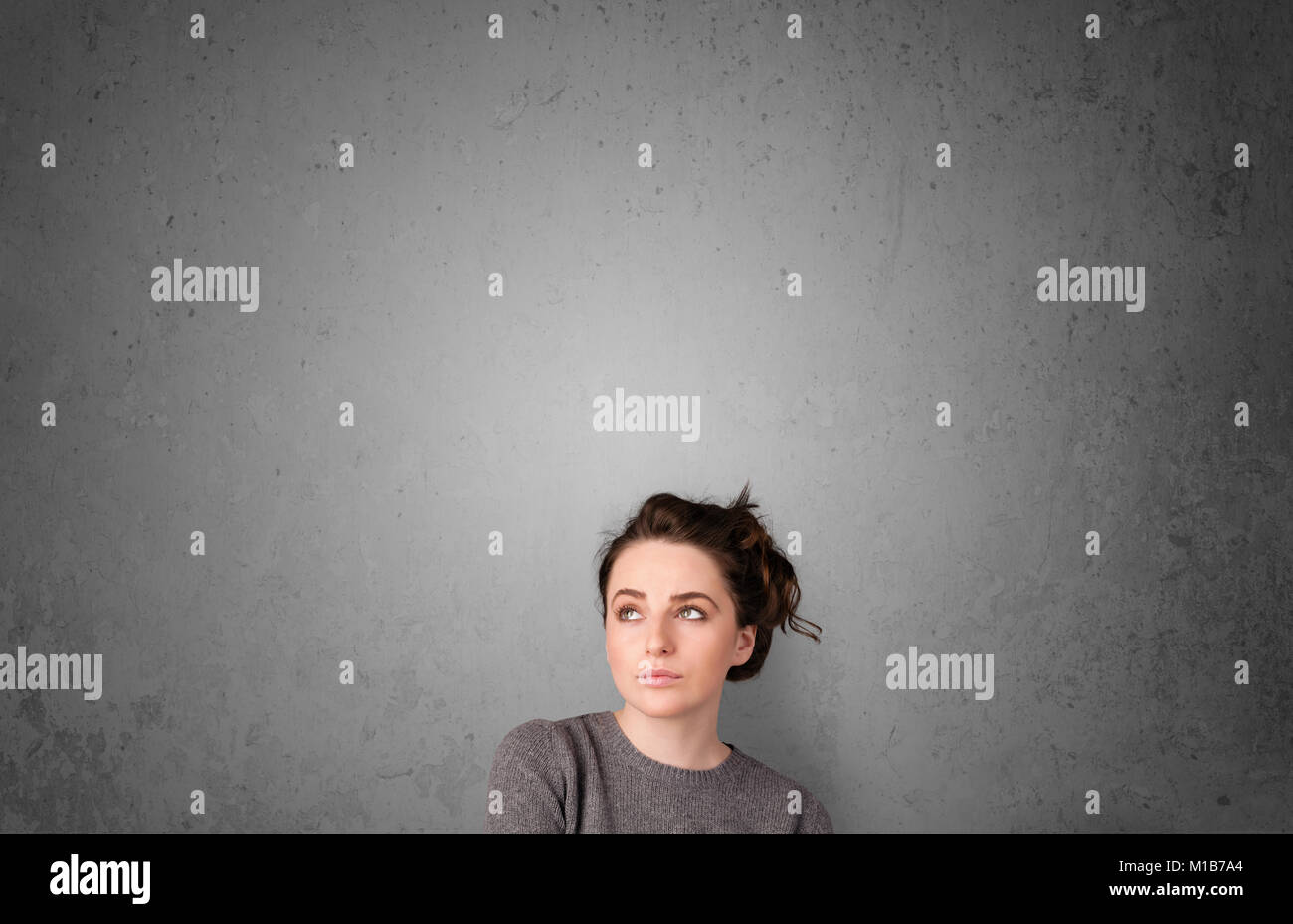 Pretty young woman gesturing with empty space Stock Photo - Alamy